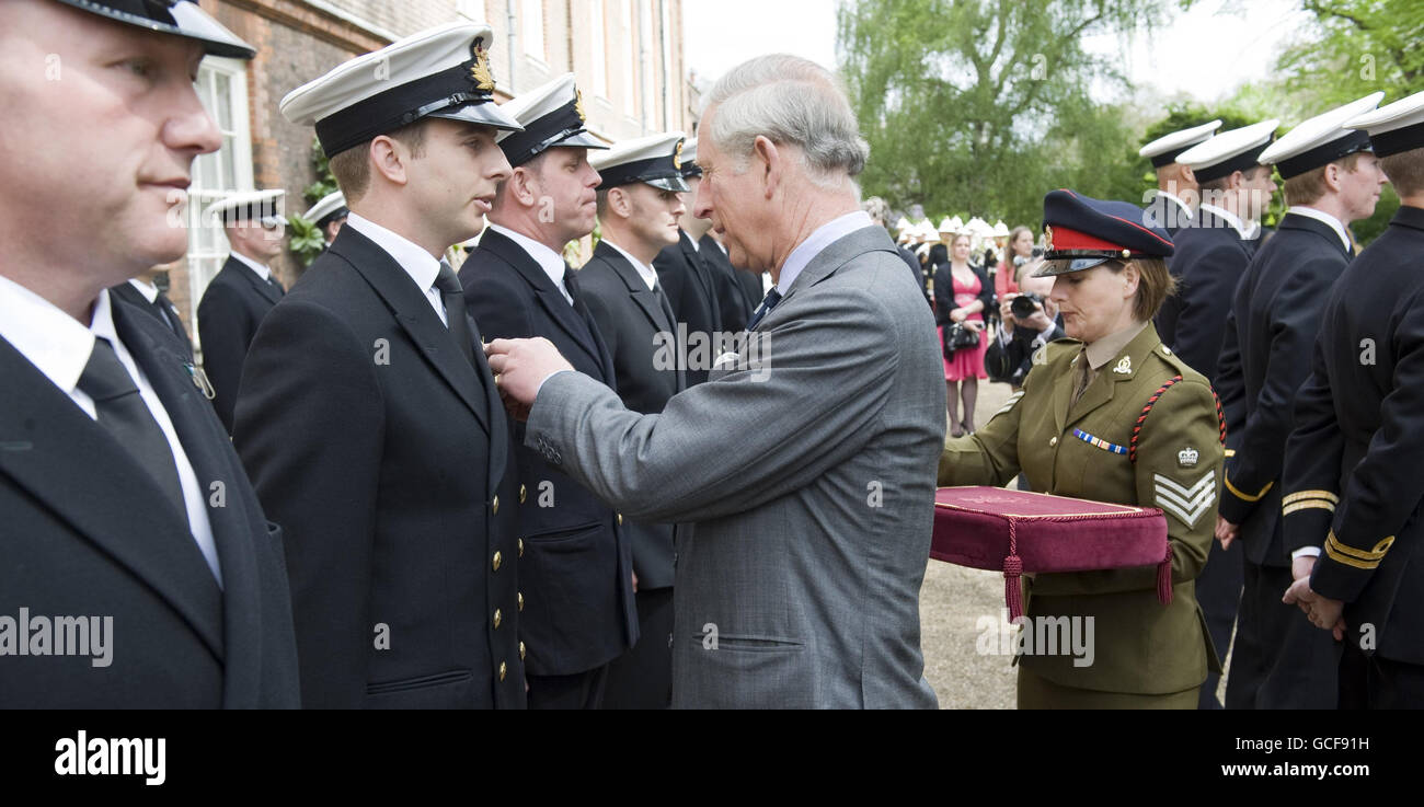 The Prince of Wales presenting Navy Lieutenant Phil Clark (second left ...