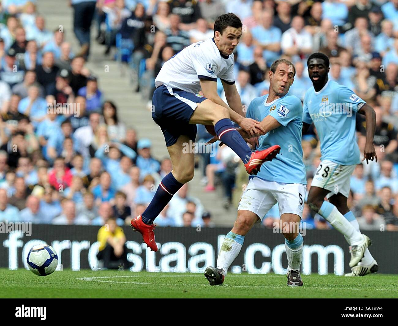 Aston Villa's Stewart Downing (left) in action against Manchester City ...