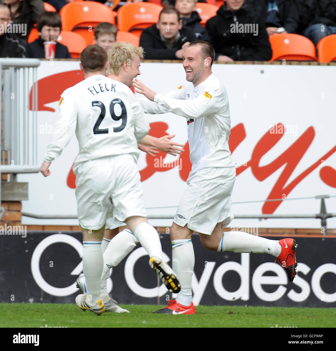 Rangers Kris Boyd (right) celebrates with Steven Smith and John Fleck ...