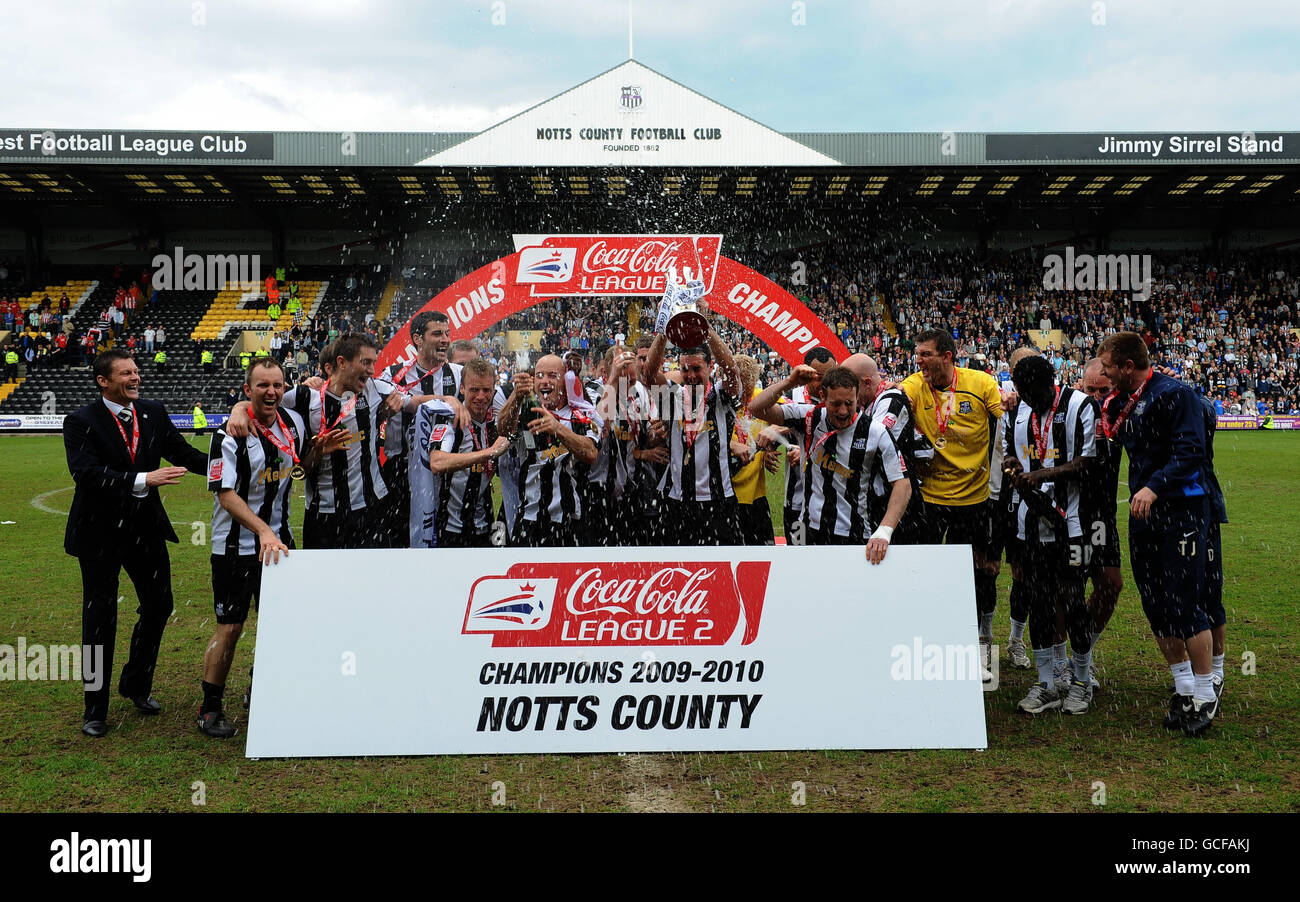 The Notts County players celebrate winning the Coca-Cola League Two ...