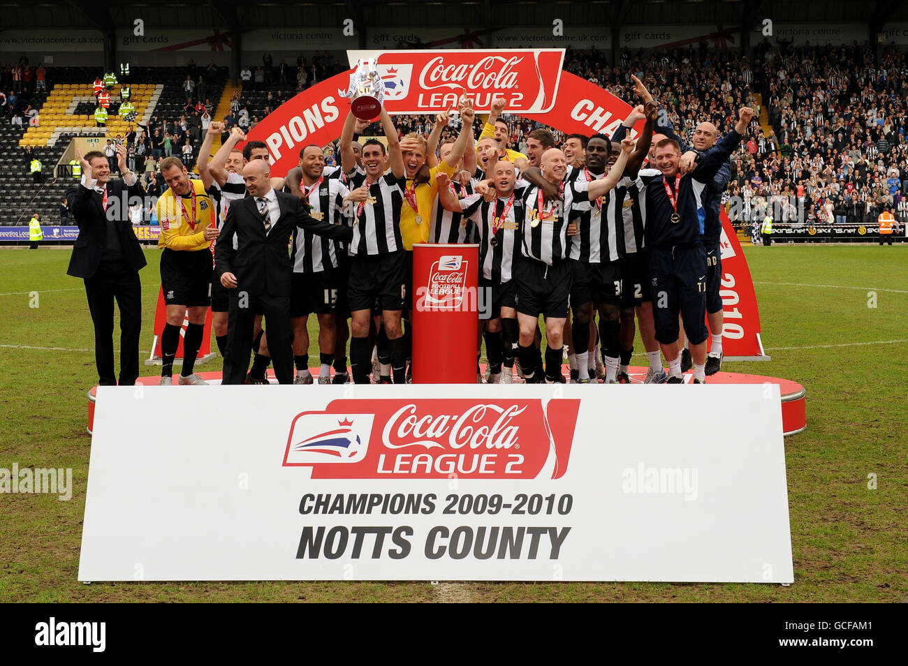 The Notts County players celebrate winning the Coca-Cola League Two ...