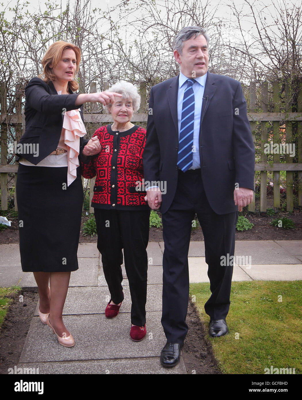 Prime Minister Gordon Brown and his wife Sarah (left), hold hands with ...