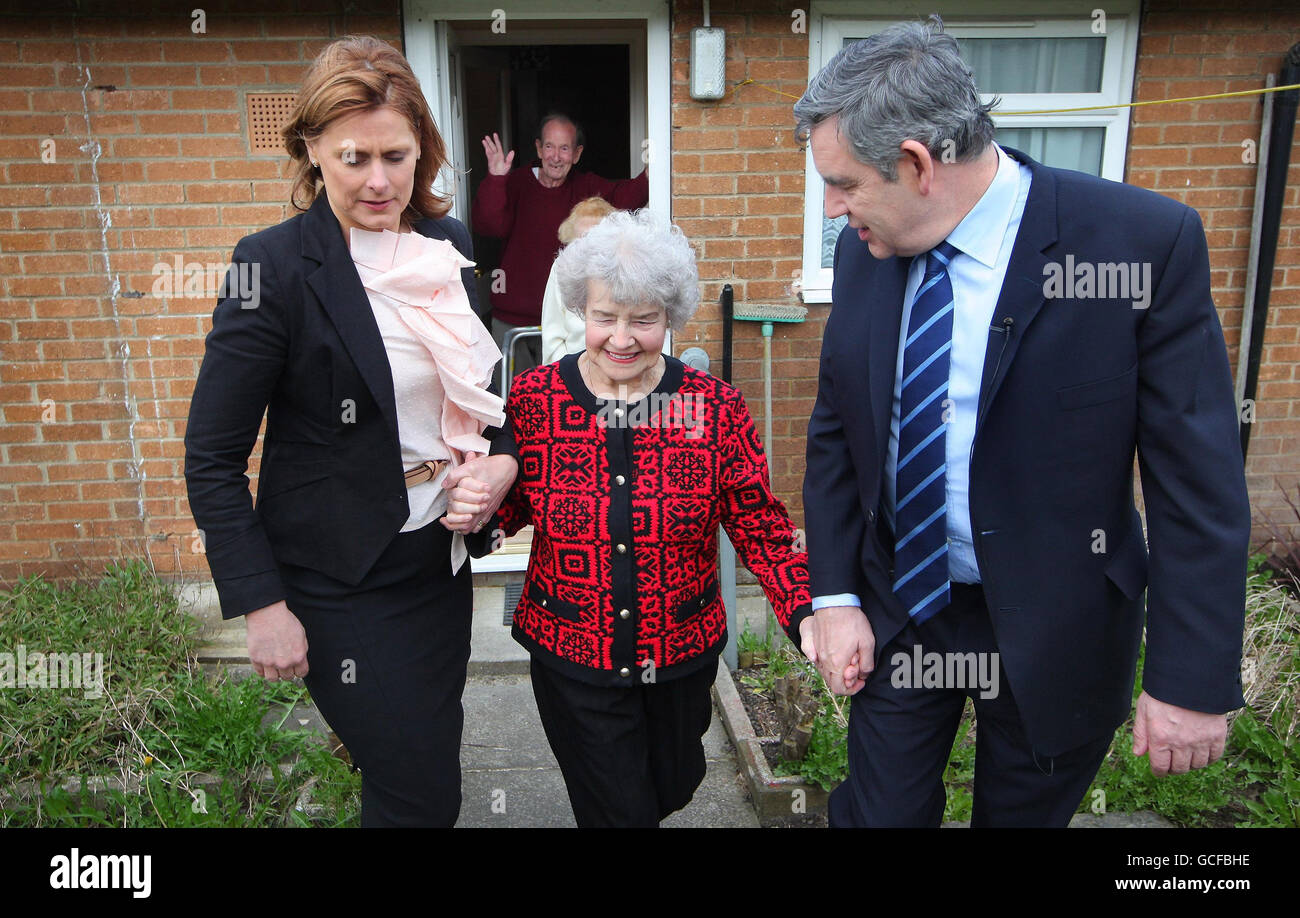 Prime Minister Gordon Brown and his wife Sarah (left), hold hands with ...