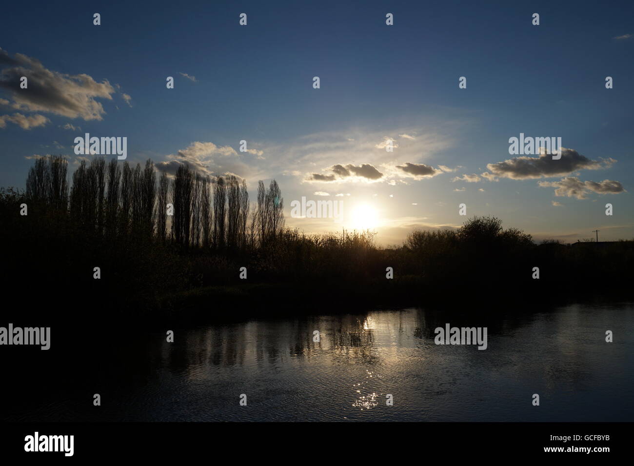 sunset on the river Stock Photo - Alamy