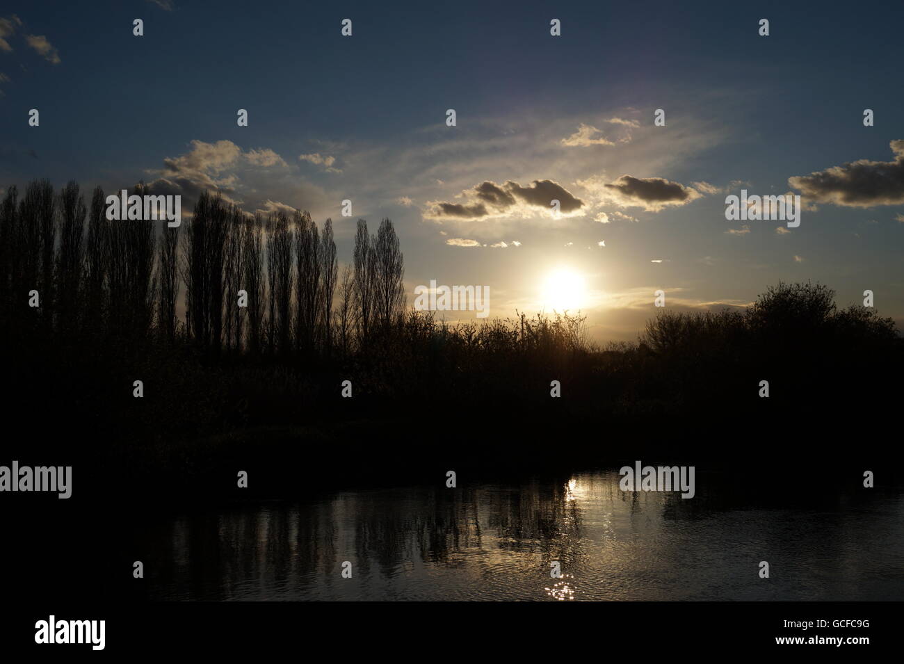 sunset on the river Stock Photo - Alamy