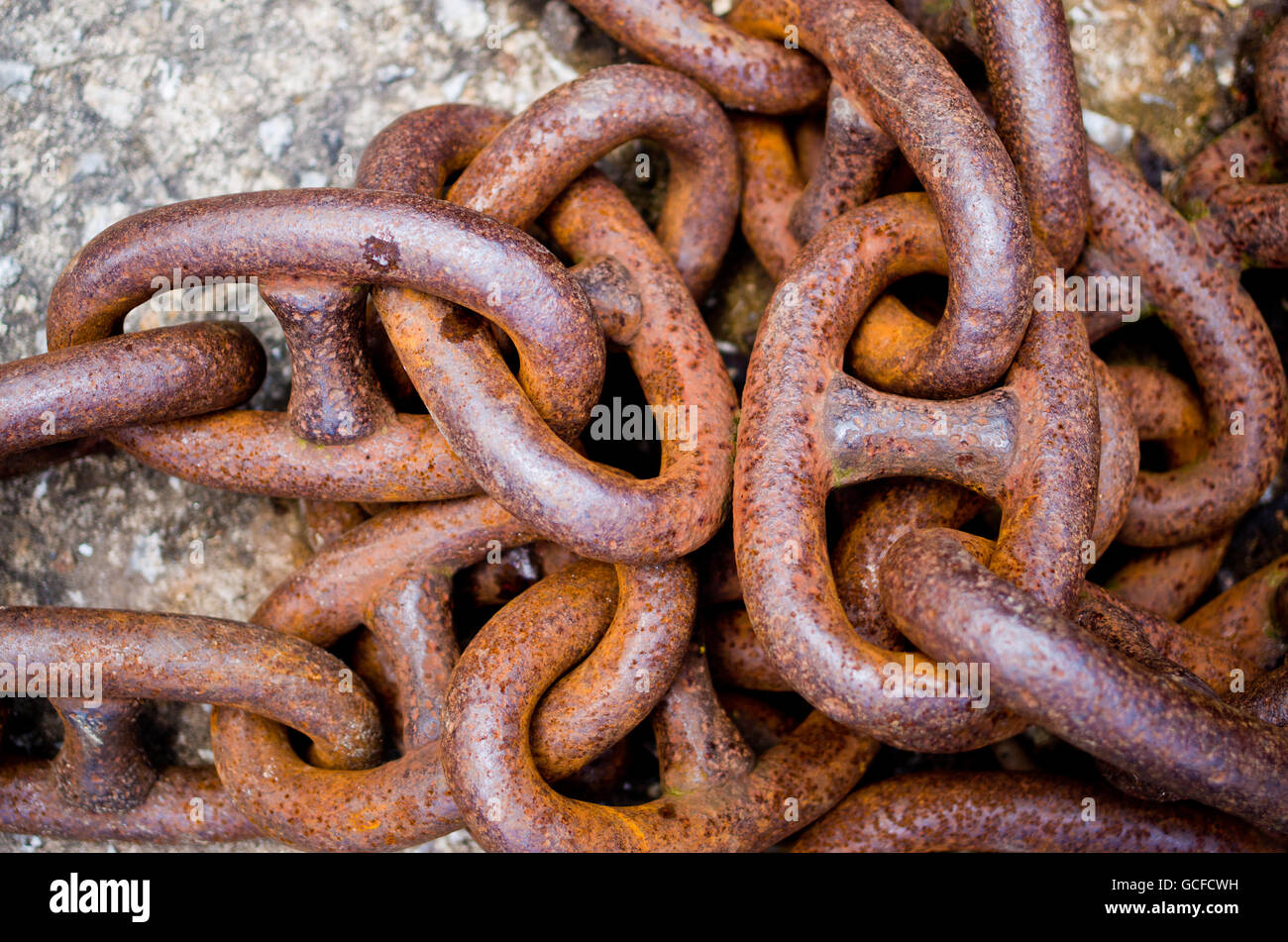 old rusty iron chains, knotted and worn from use Stock Photo - Alamy