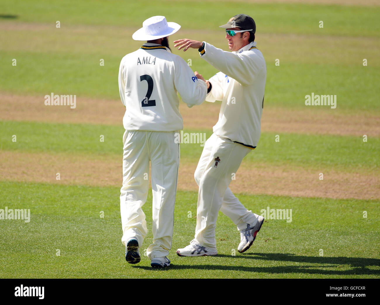 Nottinghamshire's Hashim Amla celebrates with teammate Paul Franks ...