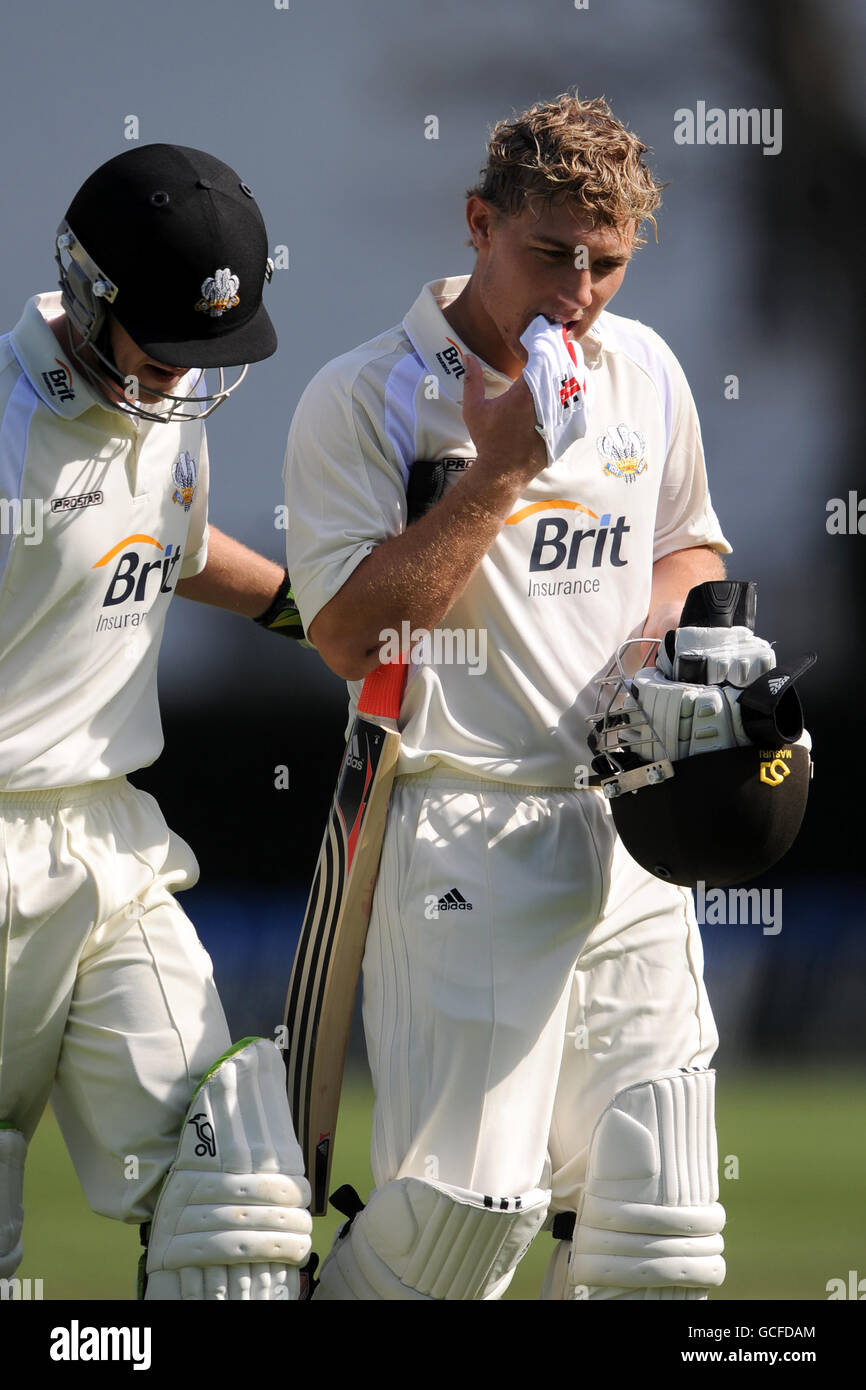 Surrey's Rory Hamilton-Brown (right) and Steven Davies (left) walk off ...