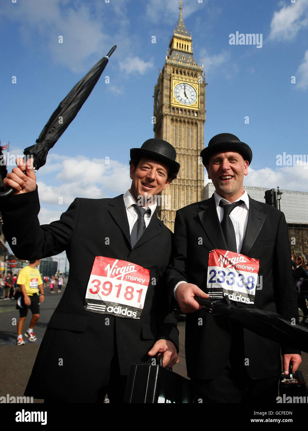 Runners in fancy dress pass 'Big Ben' and the Houses of Parliament, in ...