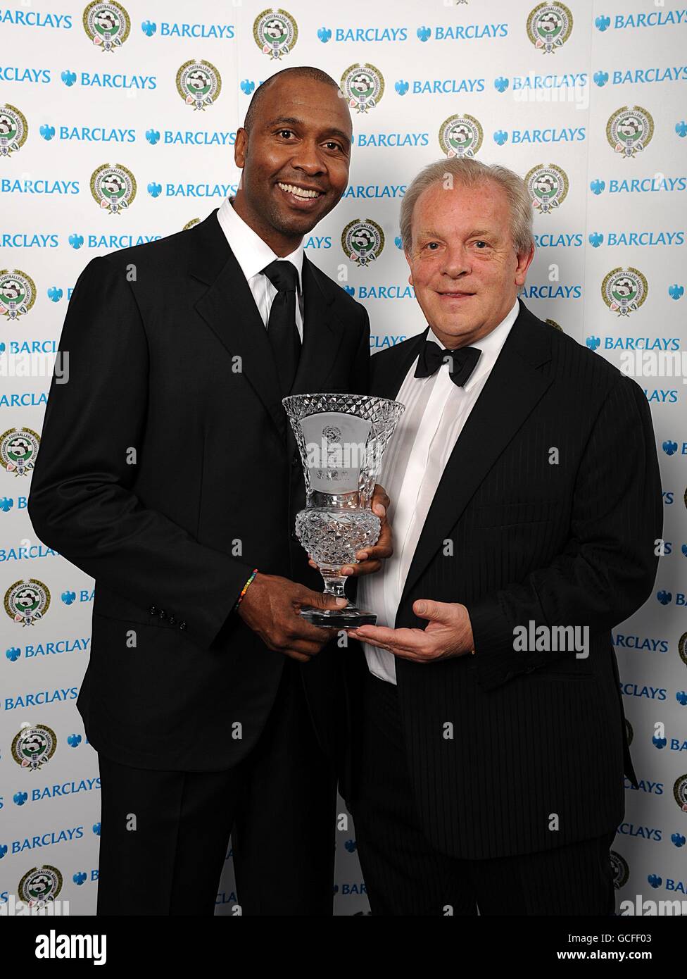 Lucas Radebe (left) with his Special Merit Award 2010 and Gordon Taylor ...
