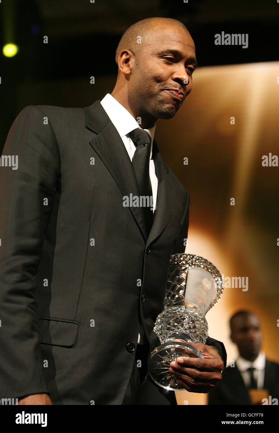 Lucas Radebe collects his Special Merit Award award on stage, at the ...