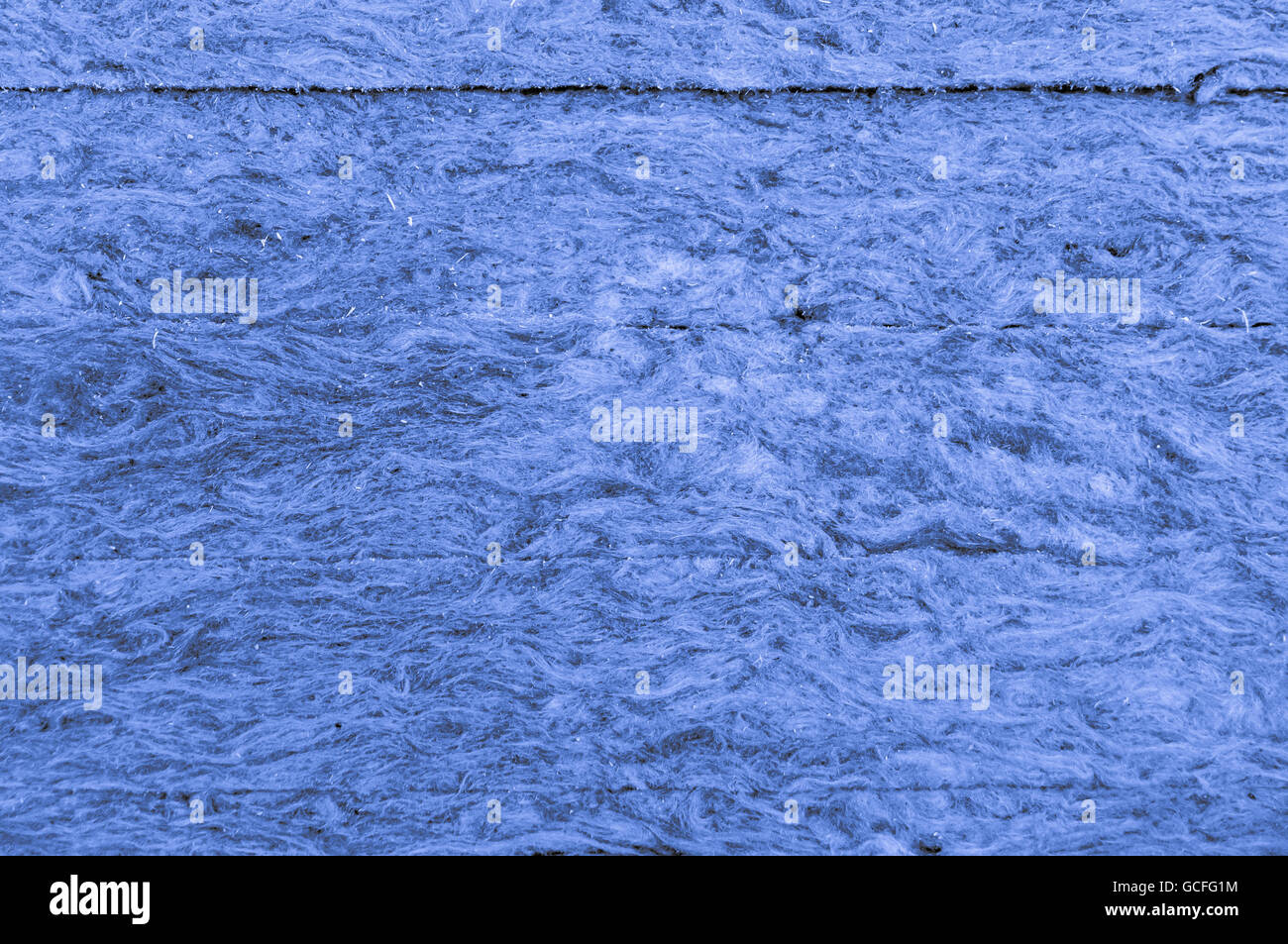 blue light grayish bluish indigo glass padding, glass wool close-up ...