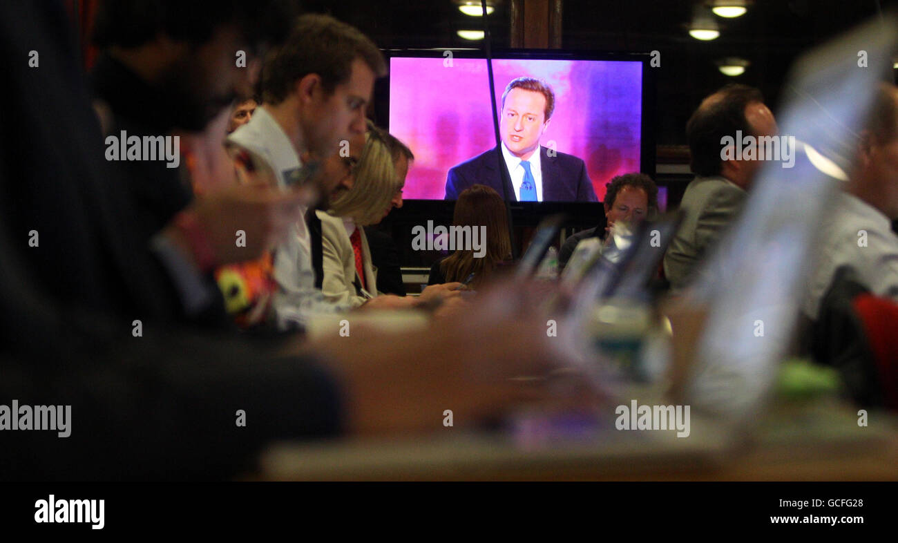 Conservative Party leader David Cameron is seen on a screen during the ...
