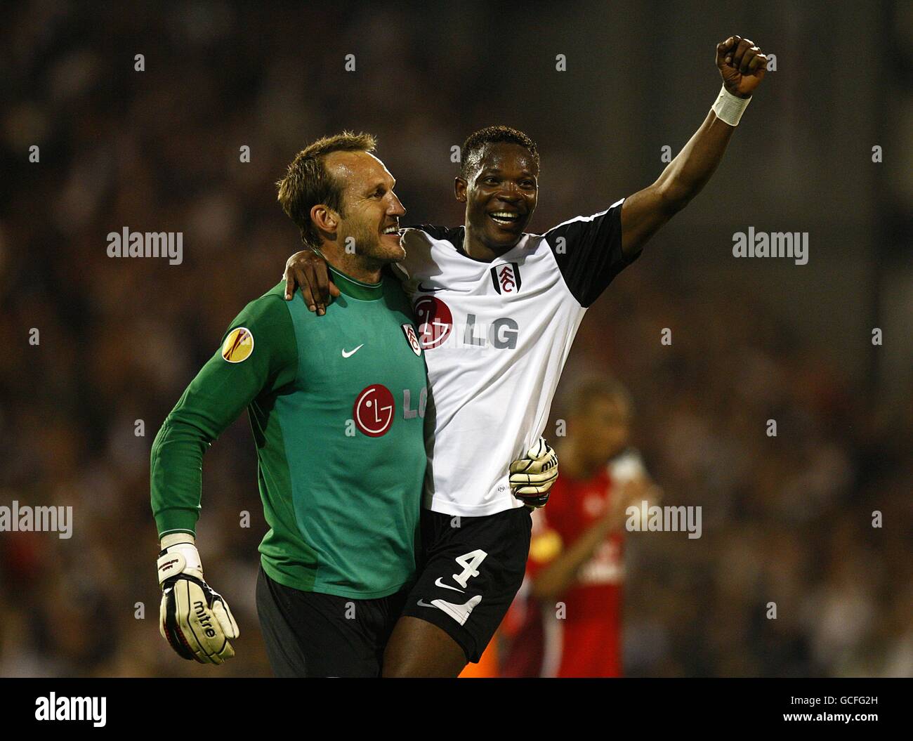 Fulham goalkeeper Mark Schwarzer (left) and John Pantsil (right ...