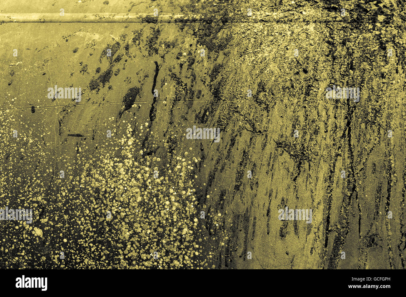 old rusty iron yellow grayish yellowish metal wall with color splashes ...