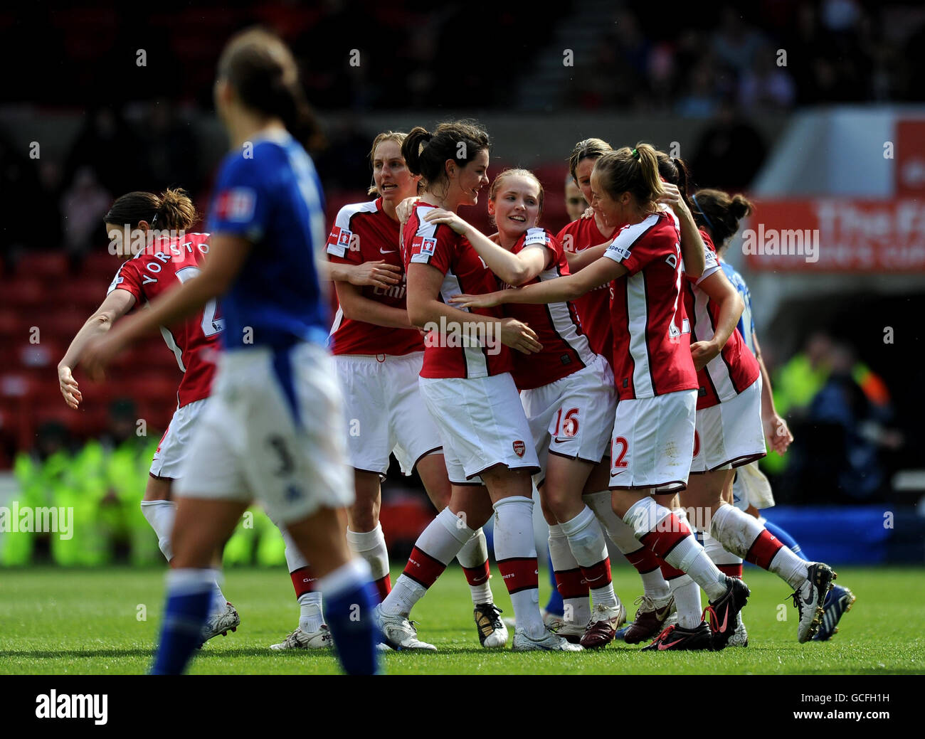 Arsenal's Kim Little (fourth right) is mobbed by her team mates after ...