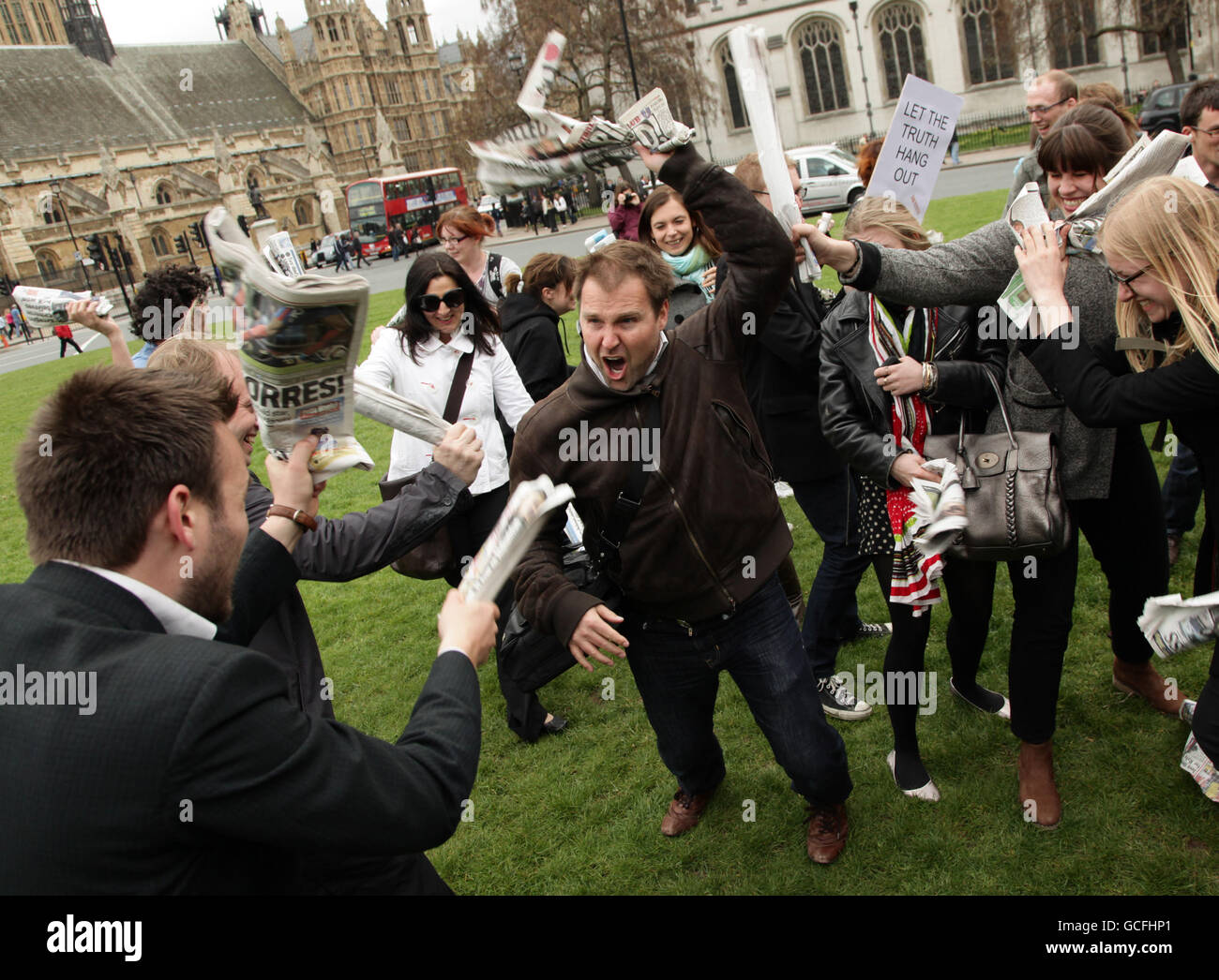 Voters from across London have a sword fight using rolled-up newspapers ...