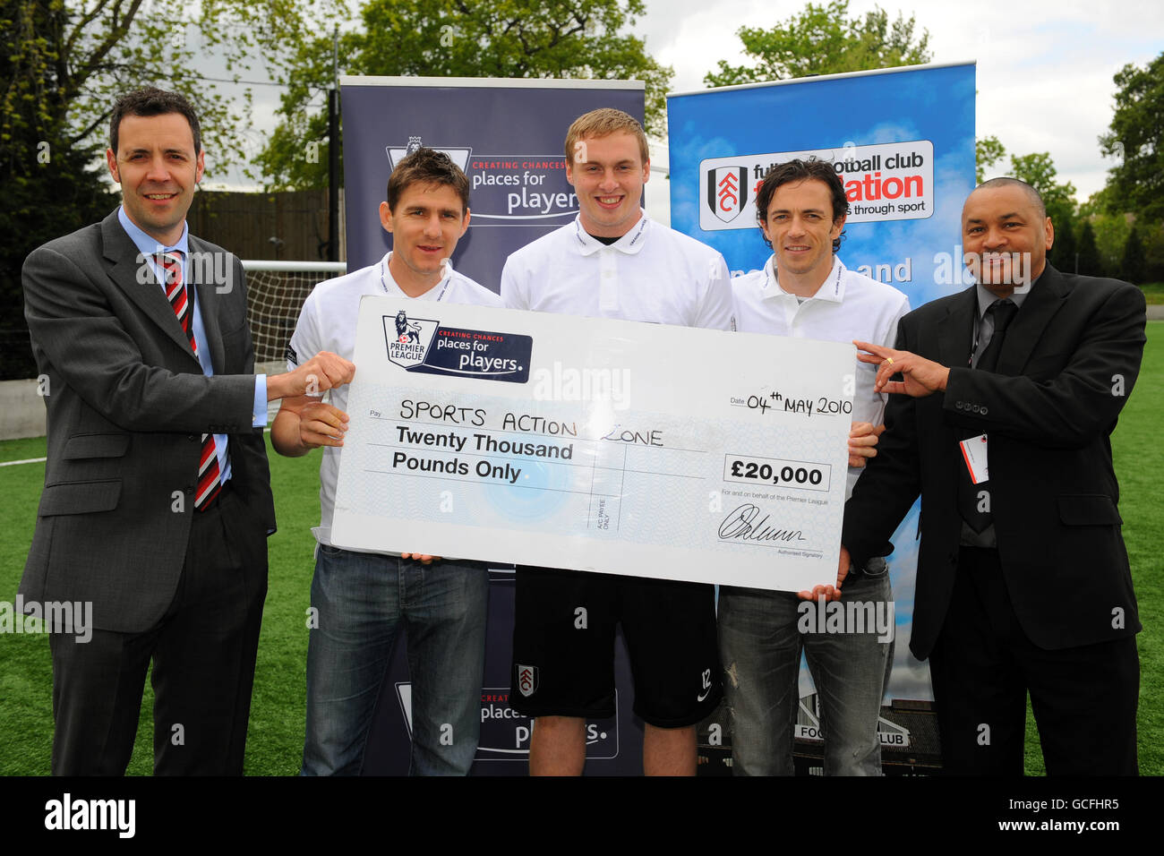 Fulham Football Club Foundation Steven Day hands over a cheque to ...