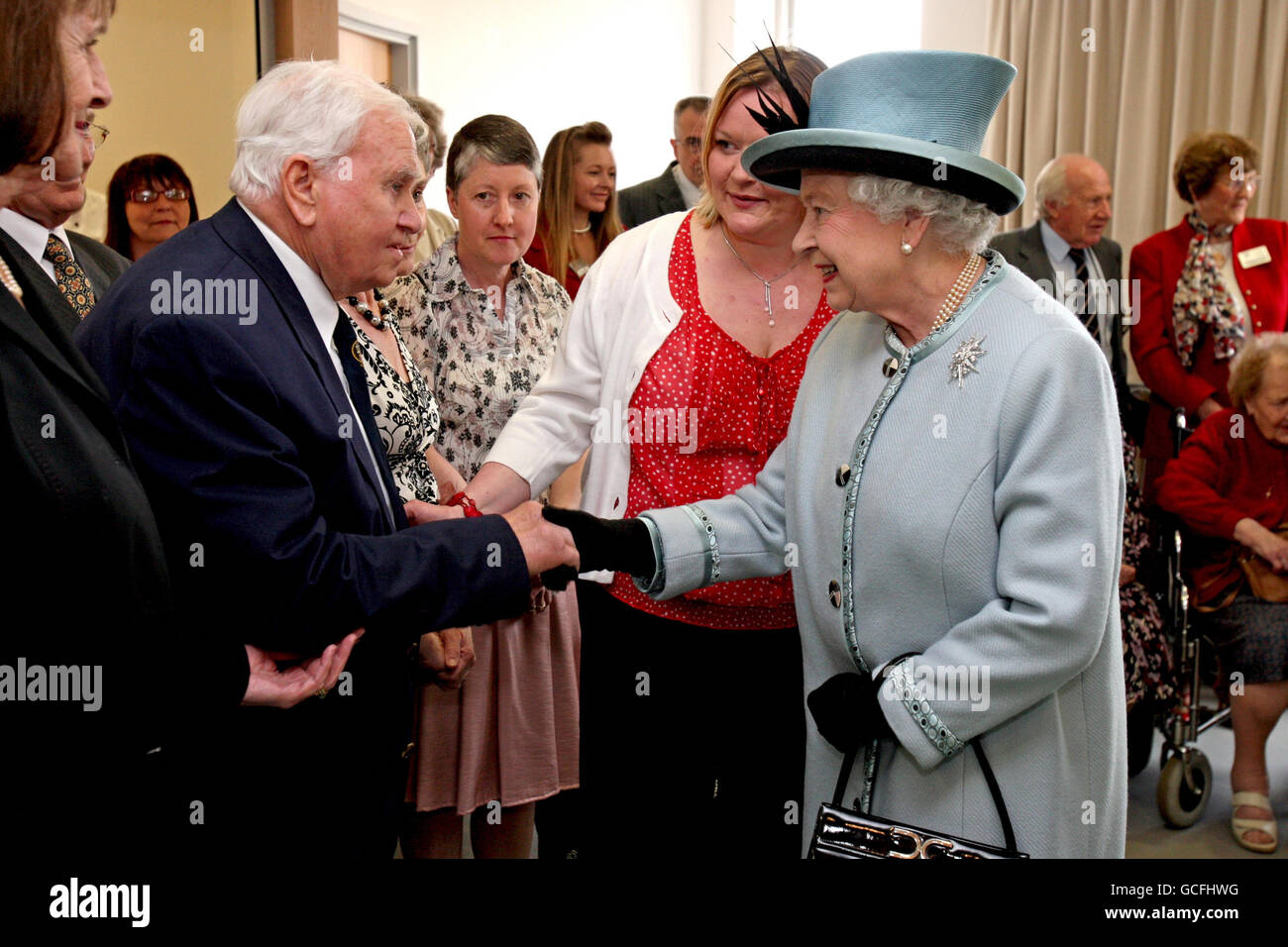 Britain's Queen Elizabeth II meets guests during a visit to the Norfolk ...