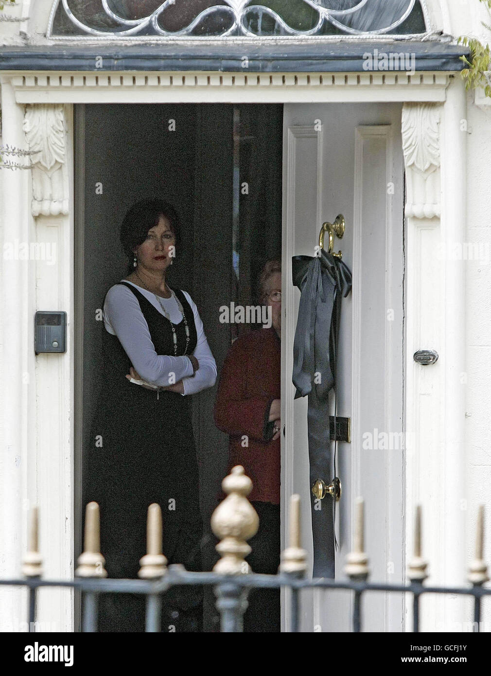 Members of Gerry Ryan's family watch as the body of Irish broadcaster ...