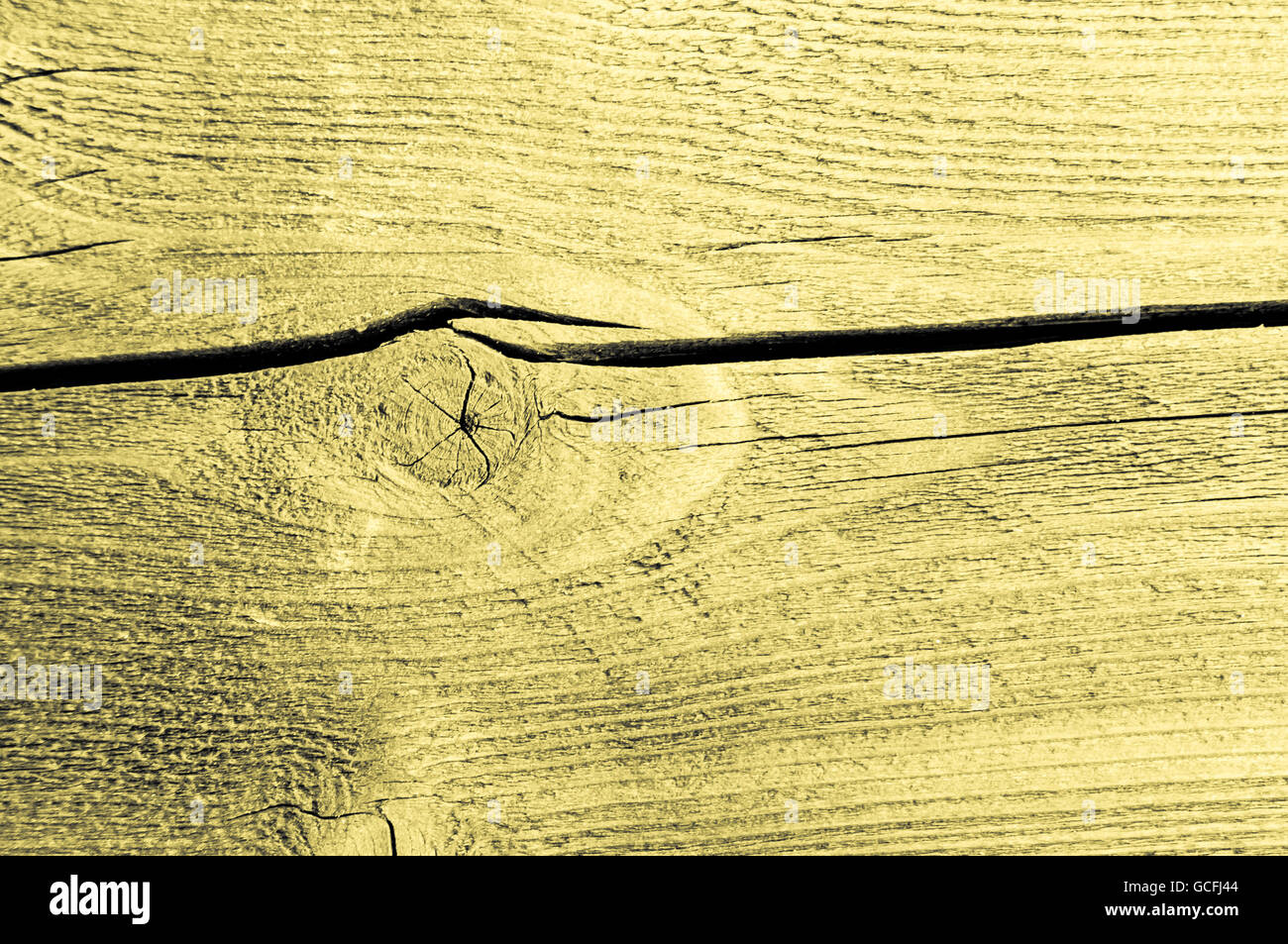 simple yellow grayish yellowish construction lath close-up lit from the ...