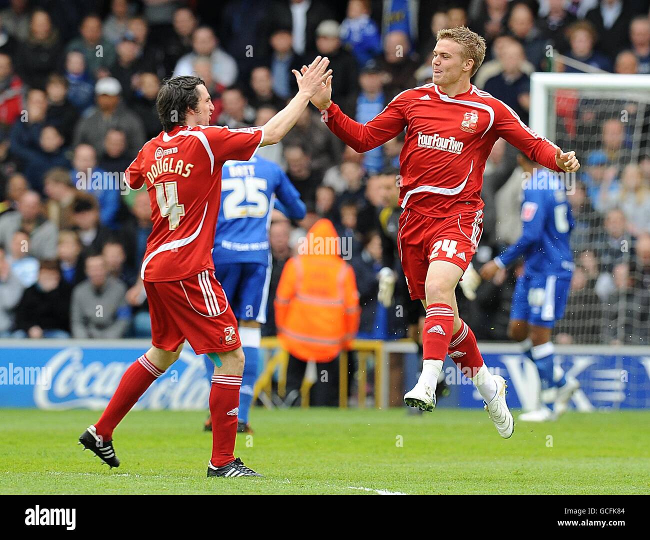 Swindon Town's Daniel Ward (right) celebrates with team mate Jonathan ...