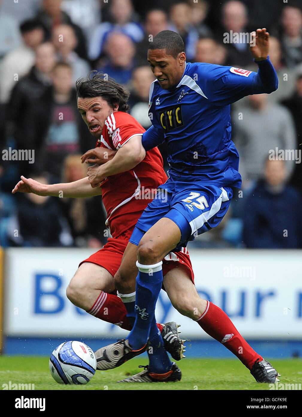 Swindon Town's Jonathan Douglas brings down Millwall's Shaun Batt in a ...