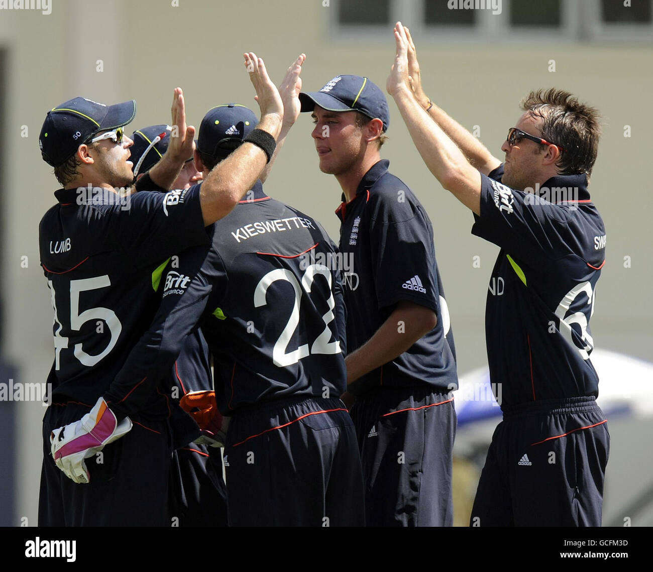 England's Graeme Swann (right) celebrates taking the wicket of New ...