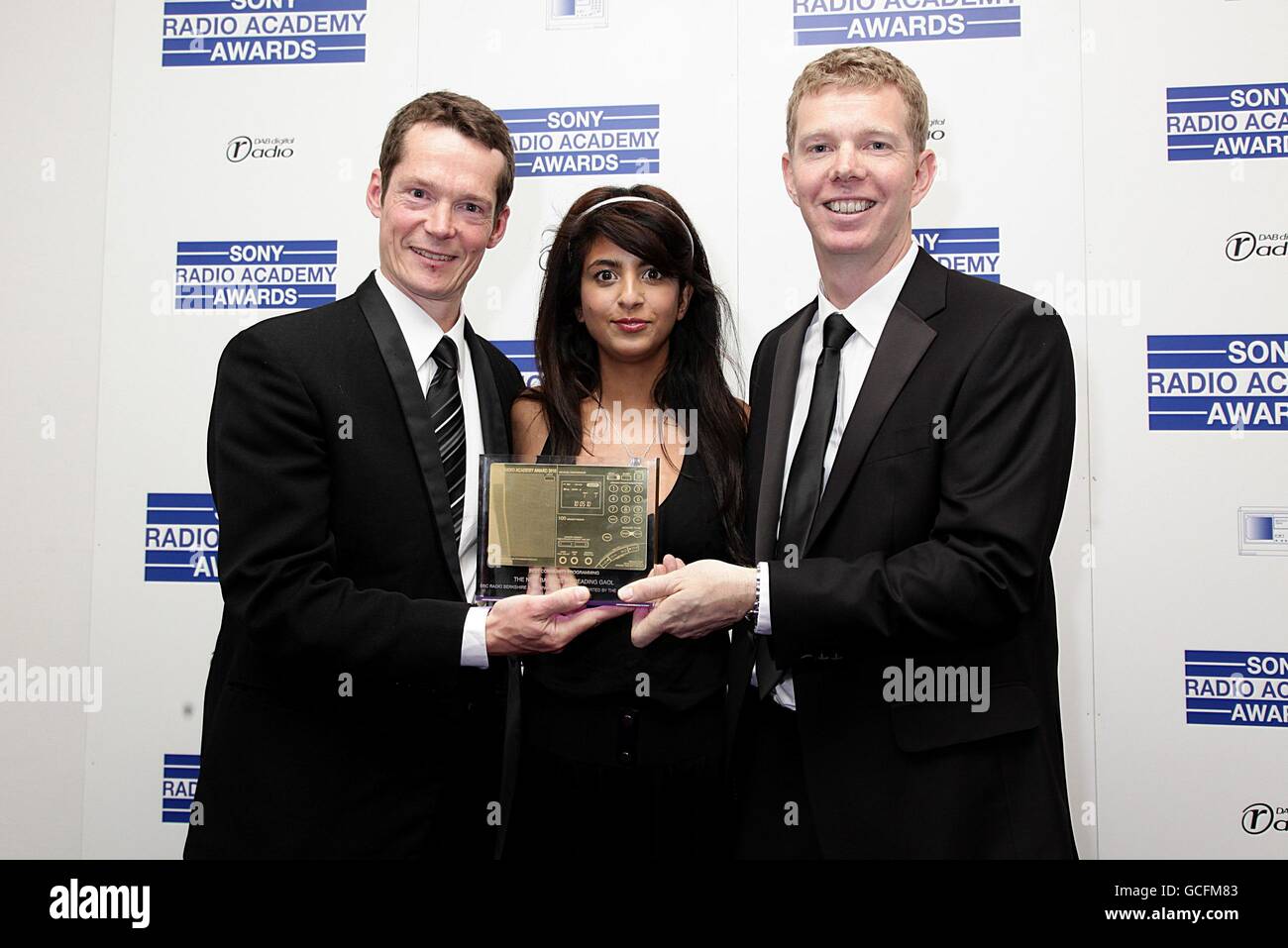 Konnie Hug (centre) presents the Best Community Programming award to ...