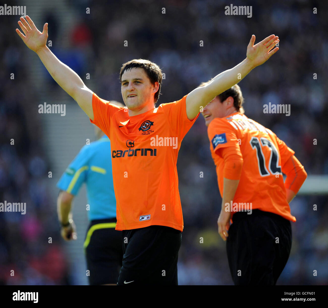 Dundee United's Craig Conway celebrates scoring their third goal of the ...
