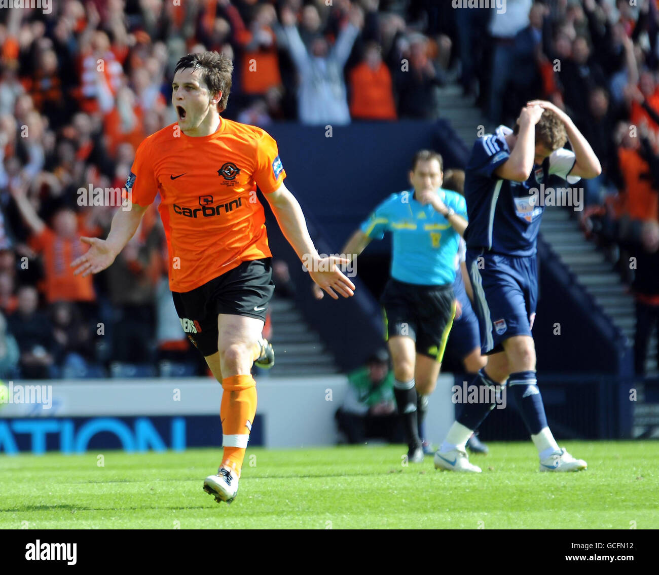 Dundee United's Craig Conway celebrates scoring their third goal of the ...
