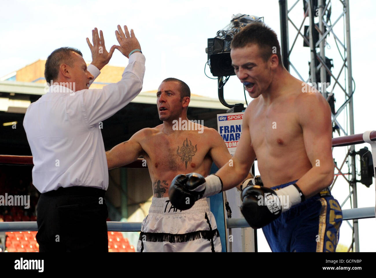 Frankie Gavin (right) celebrates victory over Gavin Tait (centre) who ...