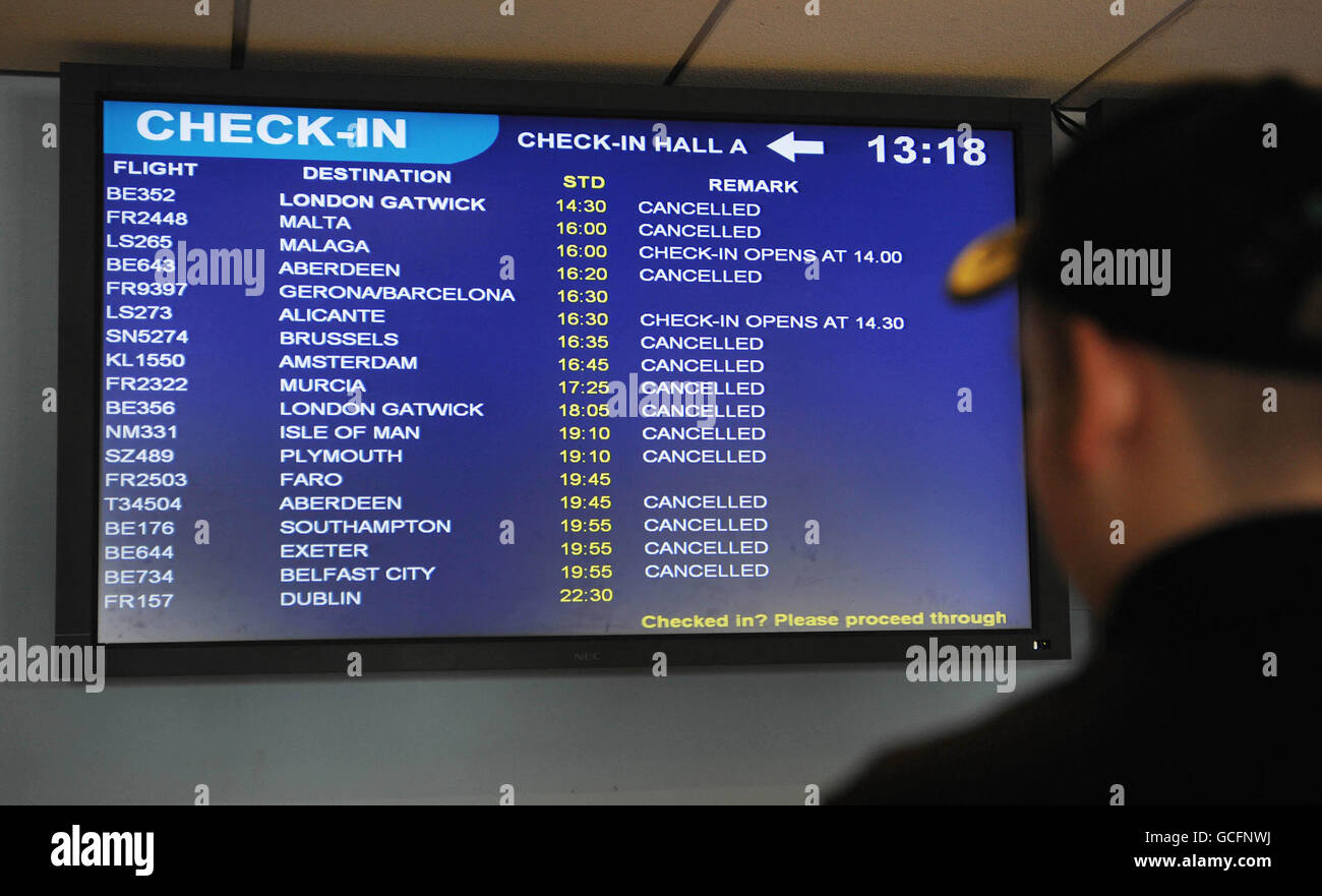 A man looks at a check-in board at Leeds Bradford Airport, which has ...