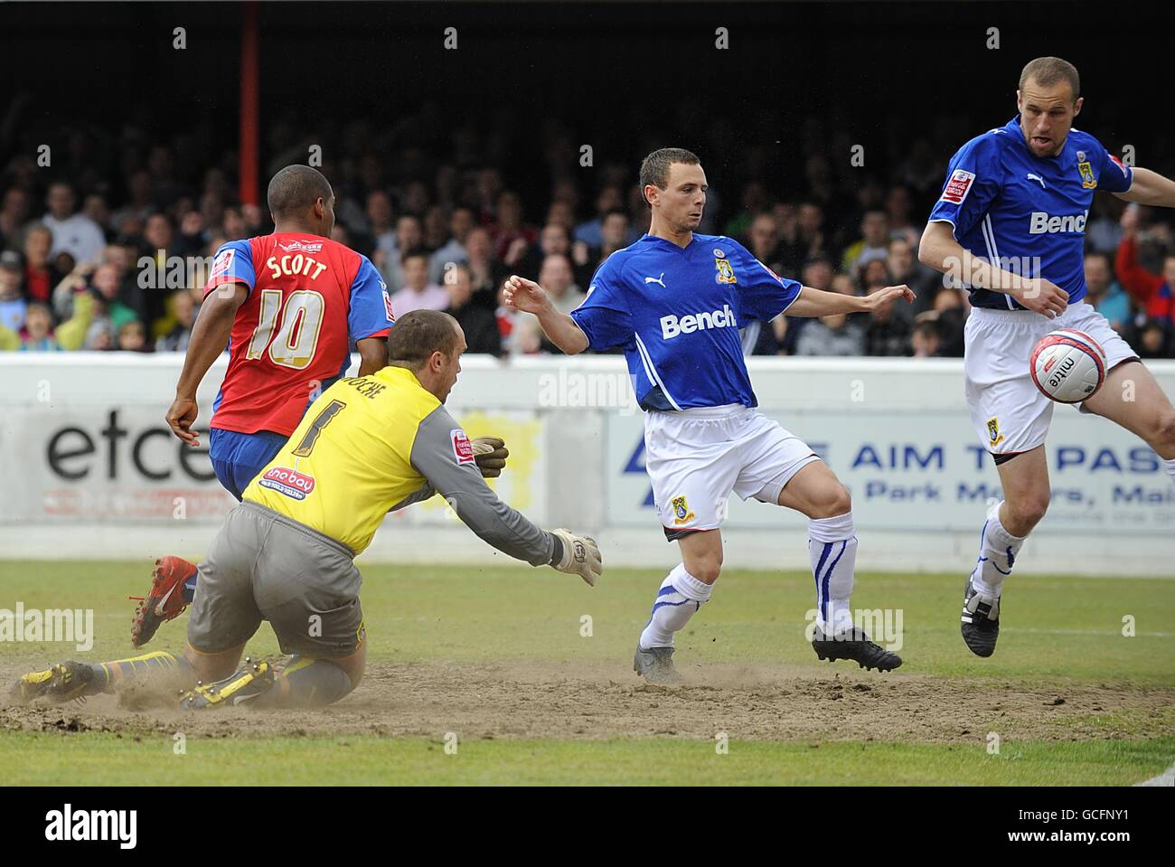 Dagenham and Redbridge's Josh Scott (left) scores his sides third goal ...