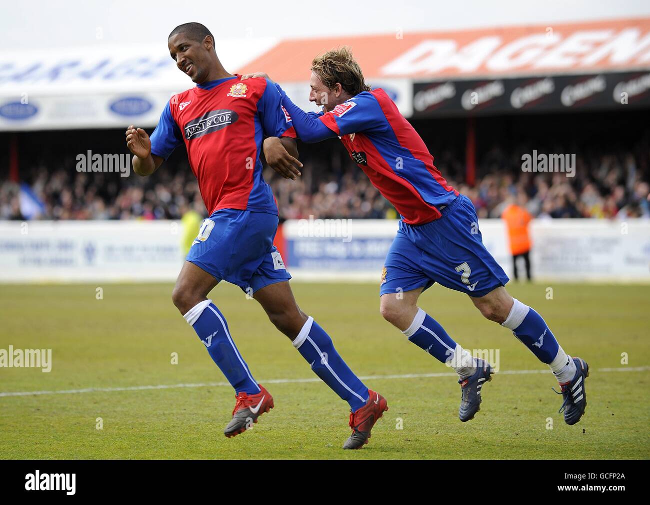 Dagenham and Redbridge's Josh Scott (left) celebrates scoring his sides ...