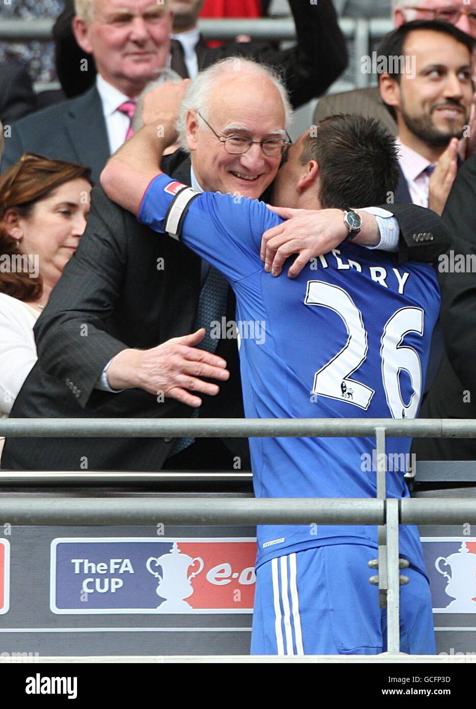 Chelsea chairman Bruce Buck (left) congratulates captain John Terry ...