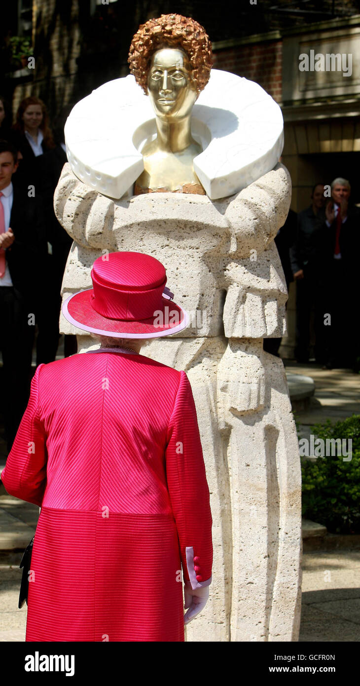Britain's Queen Elizabeth II, looks at a statue of Queen Elizabeth I ...