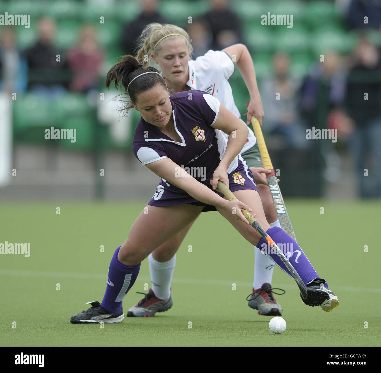 Durham's Emma Pladge (front) holds off Cannock's Emmie Le Marchand ...