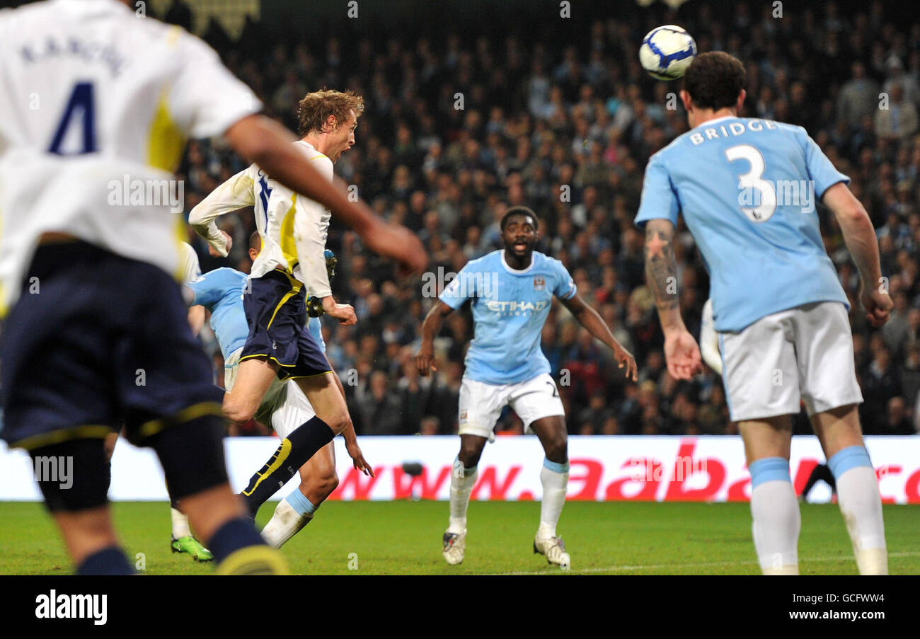 Tottenham Hotspur's Peter Crouch (left) scores the opening goal during ...
