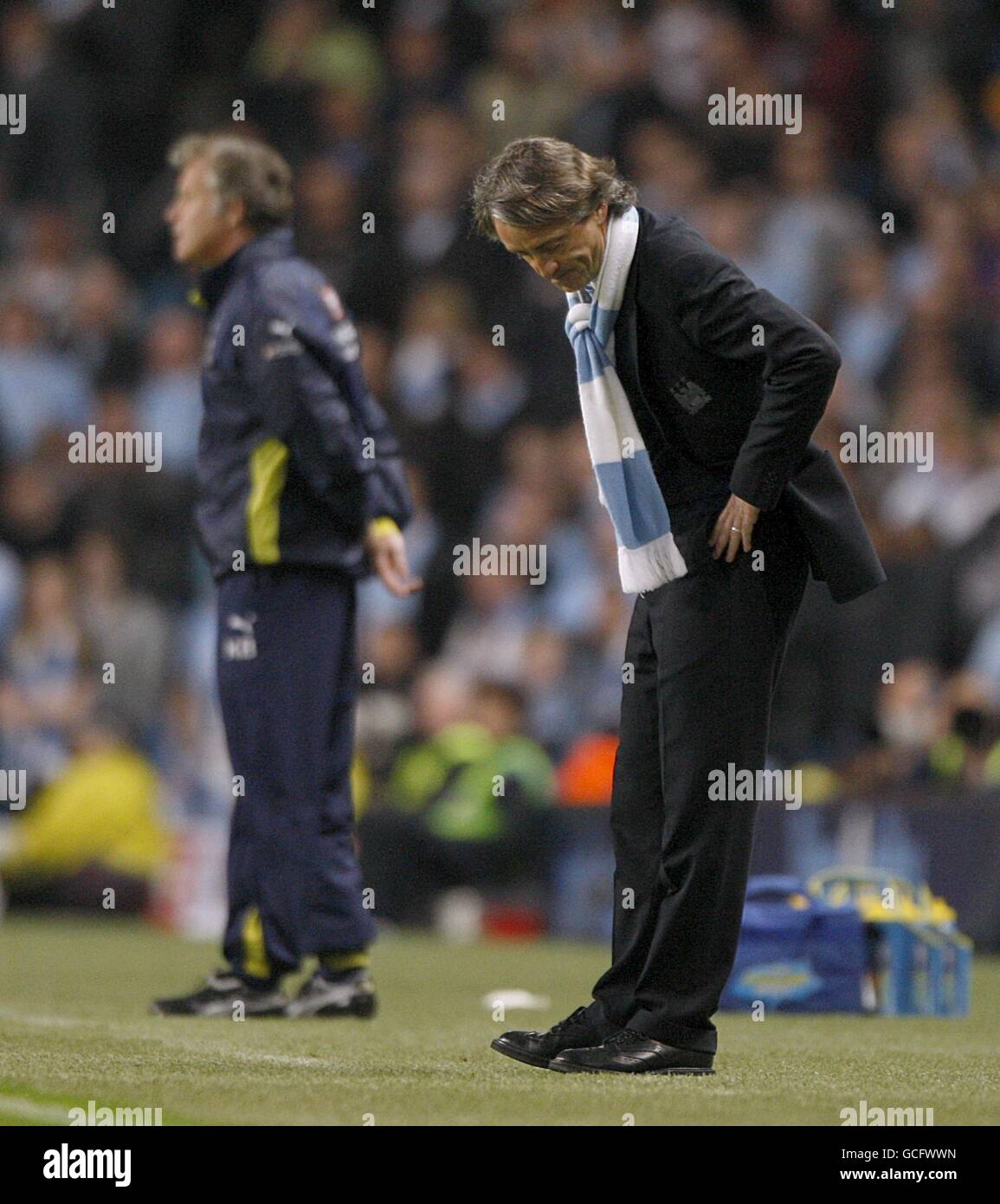 Tottenham Hotspur's assistant manager Kevin Bond (left) and Manchester ...