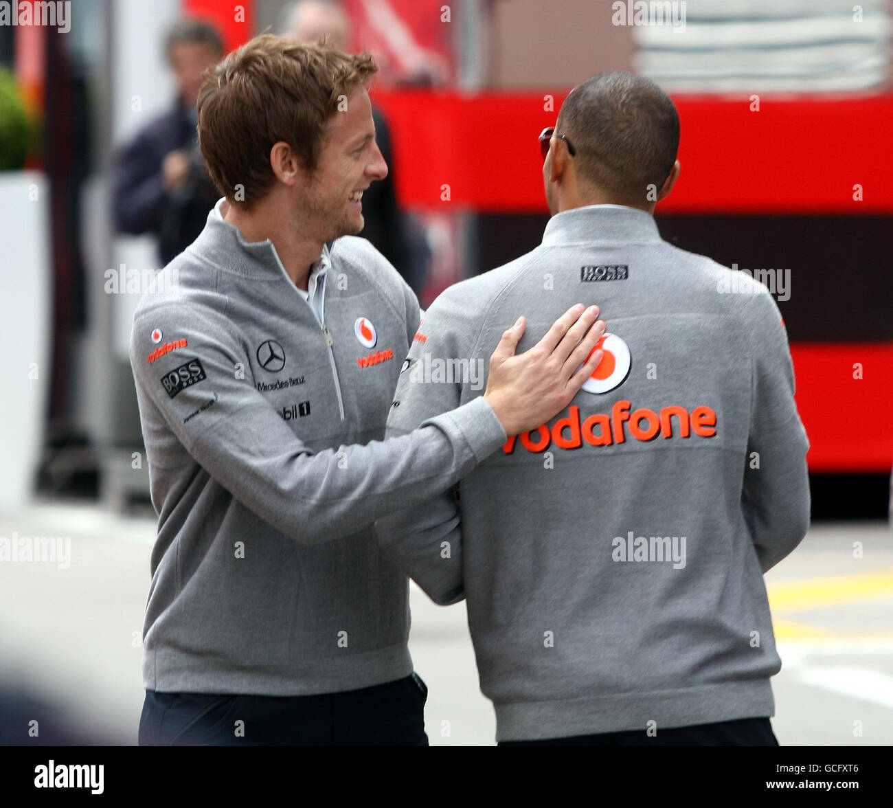 Vodafone McLaren drivers Jenson Button greets Lewis Hamilton during the ...