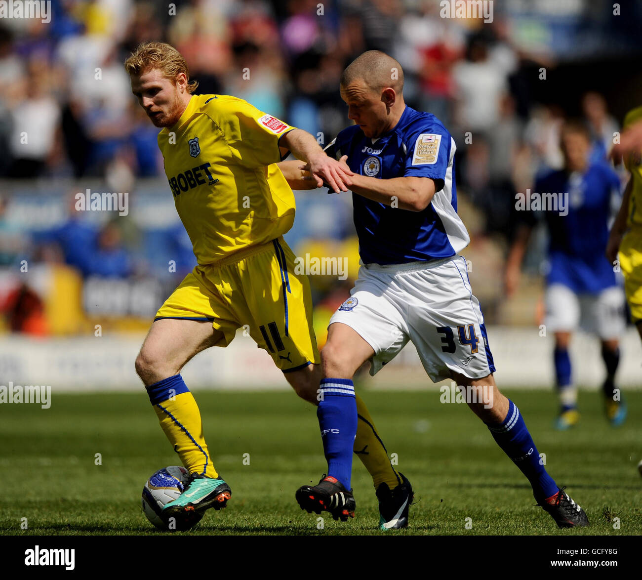 Leicester City's Jay Spearing and Cardiff City's Chris Burke (left ...