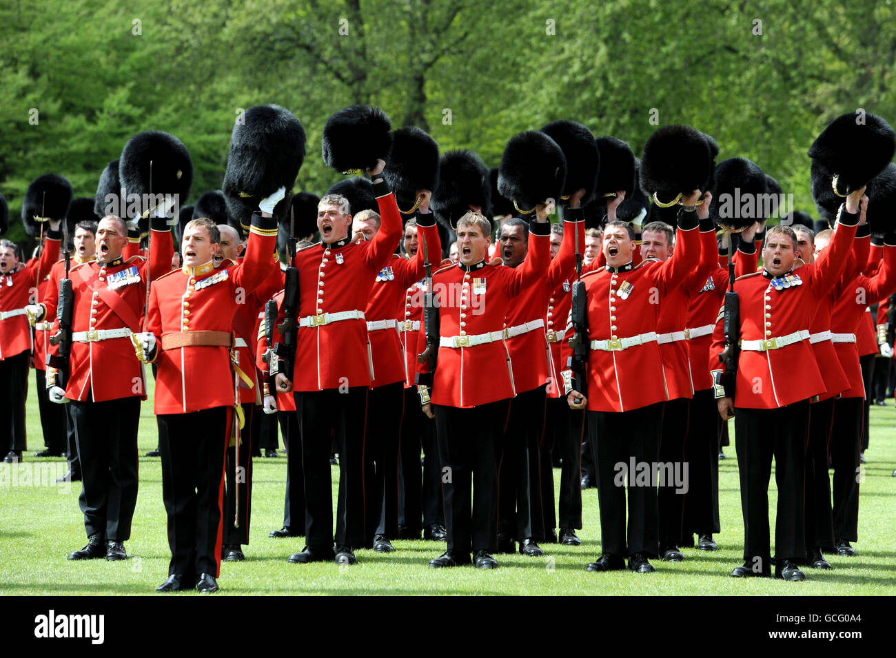 The Grenadier Guards cheer Queen Elizabeth II after she presented the ...