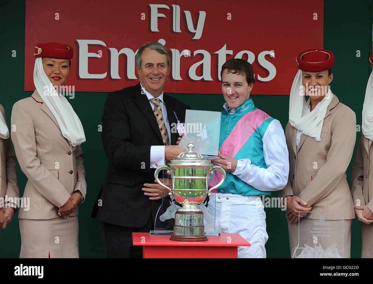 Jockey Tom Queally (2nd right) recieves his trophy after riding ...