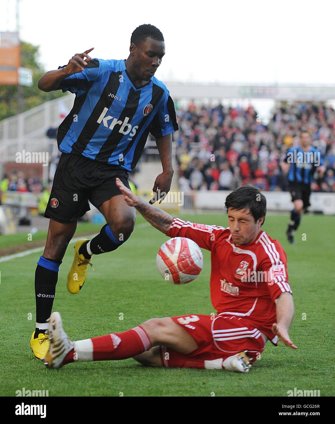 Charlton Athletic's Lloyd Sam (left) and Swindon Town's Alan Sheehan ...