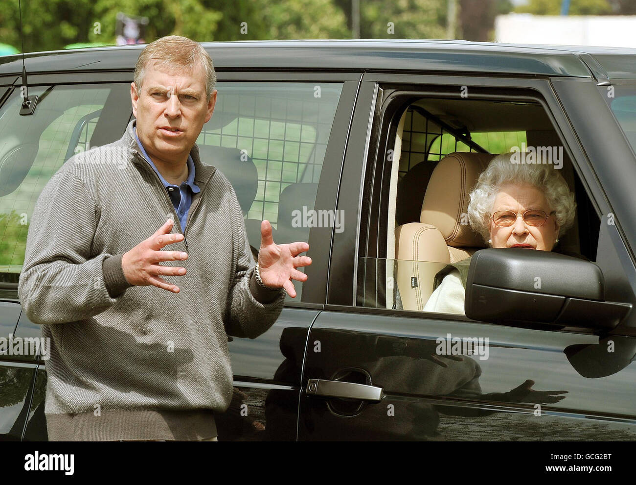 The Queen sits in her Land Rover as she and the Duke of York watch the ...