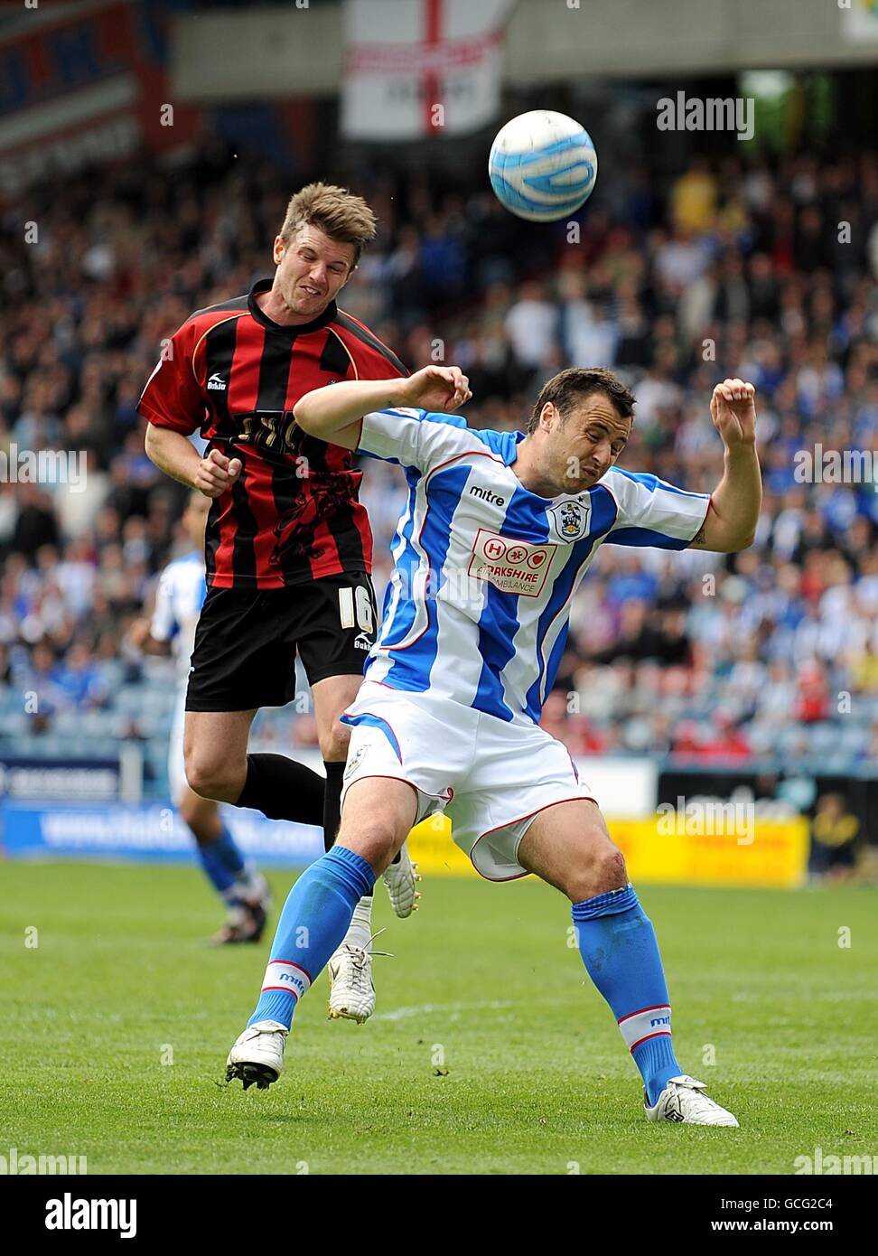 Millwall's Darren Ward (left) and Huddersfield Town's Antony Kay battle ...