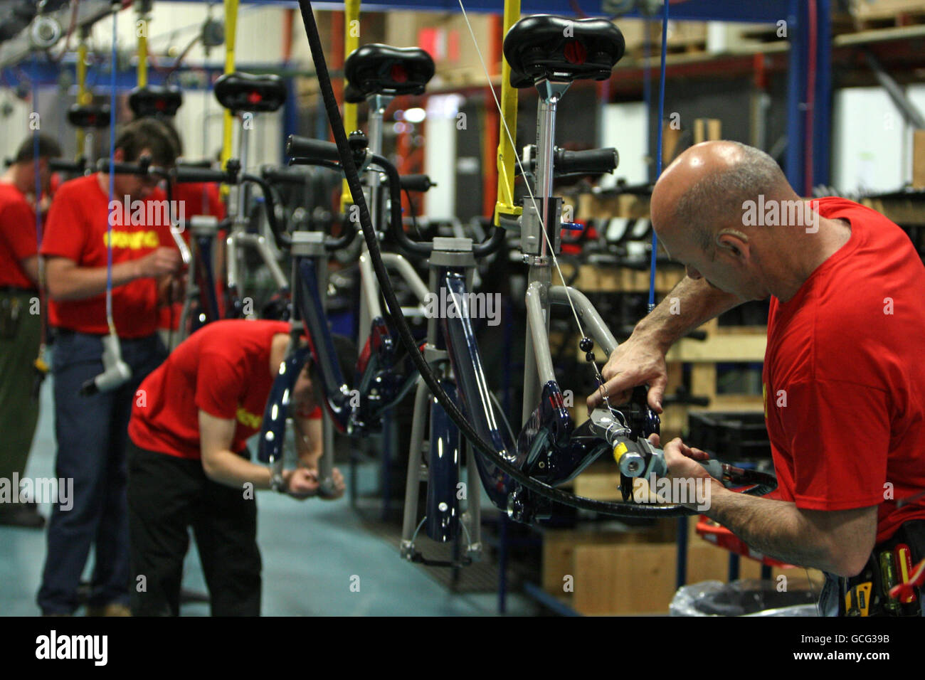 Workers assemble bikes for the London Cycle Hire Scheme at the factory ...