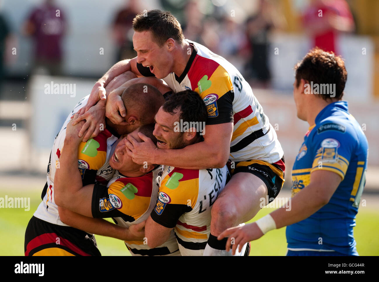 Bradford Bulls' Michael Platt (centre) is mobbed by teammates after ...