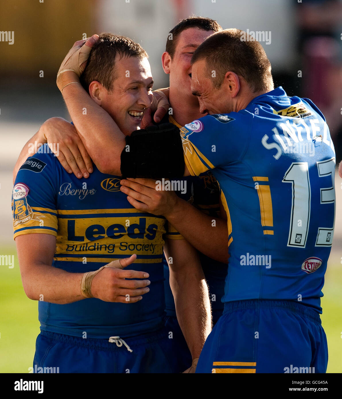 Leeds Rhinos' Danny McGuire (left) celebrates scoring his third try ...